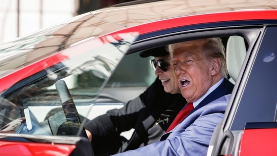 Donald Trump purchases red Tesla Model S car from Elon Musk